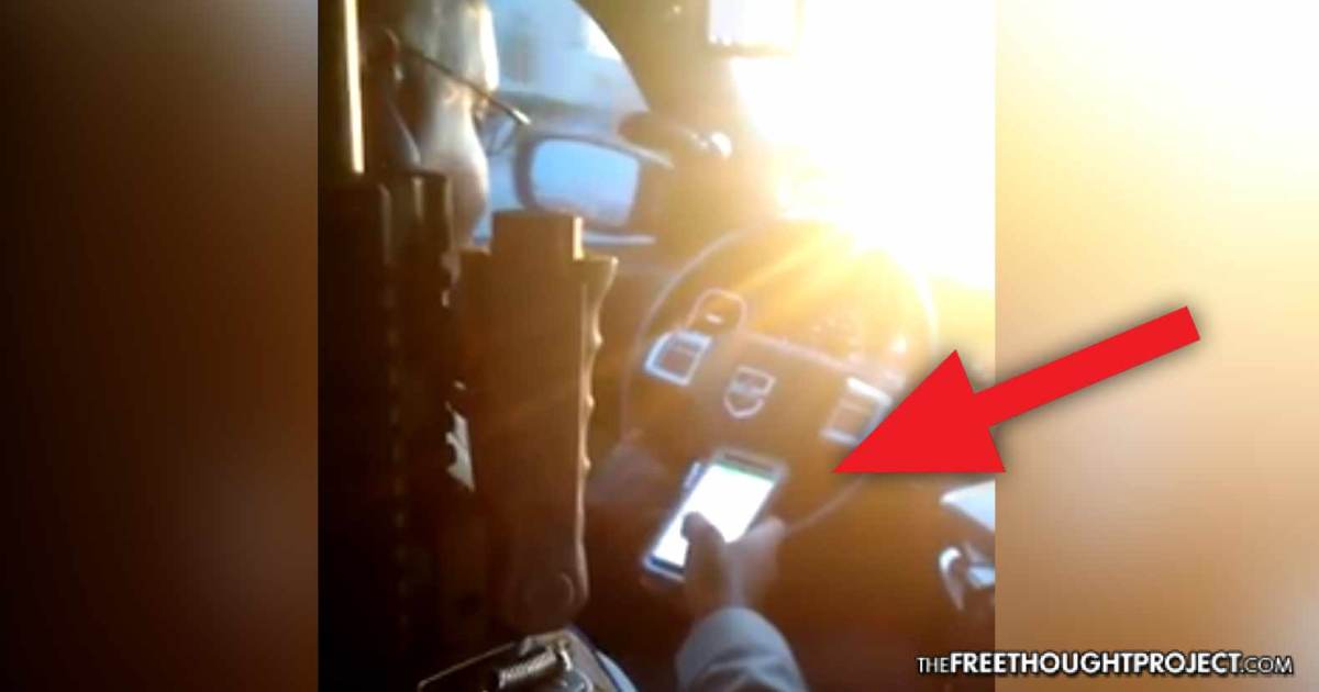 Watch Handcuffed Man Records Cop Breaking The Law From Inside The